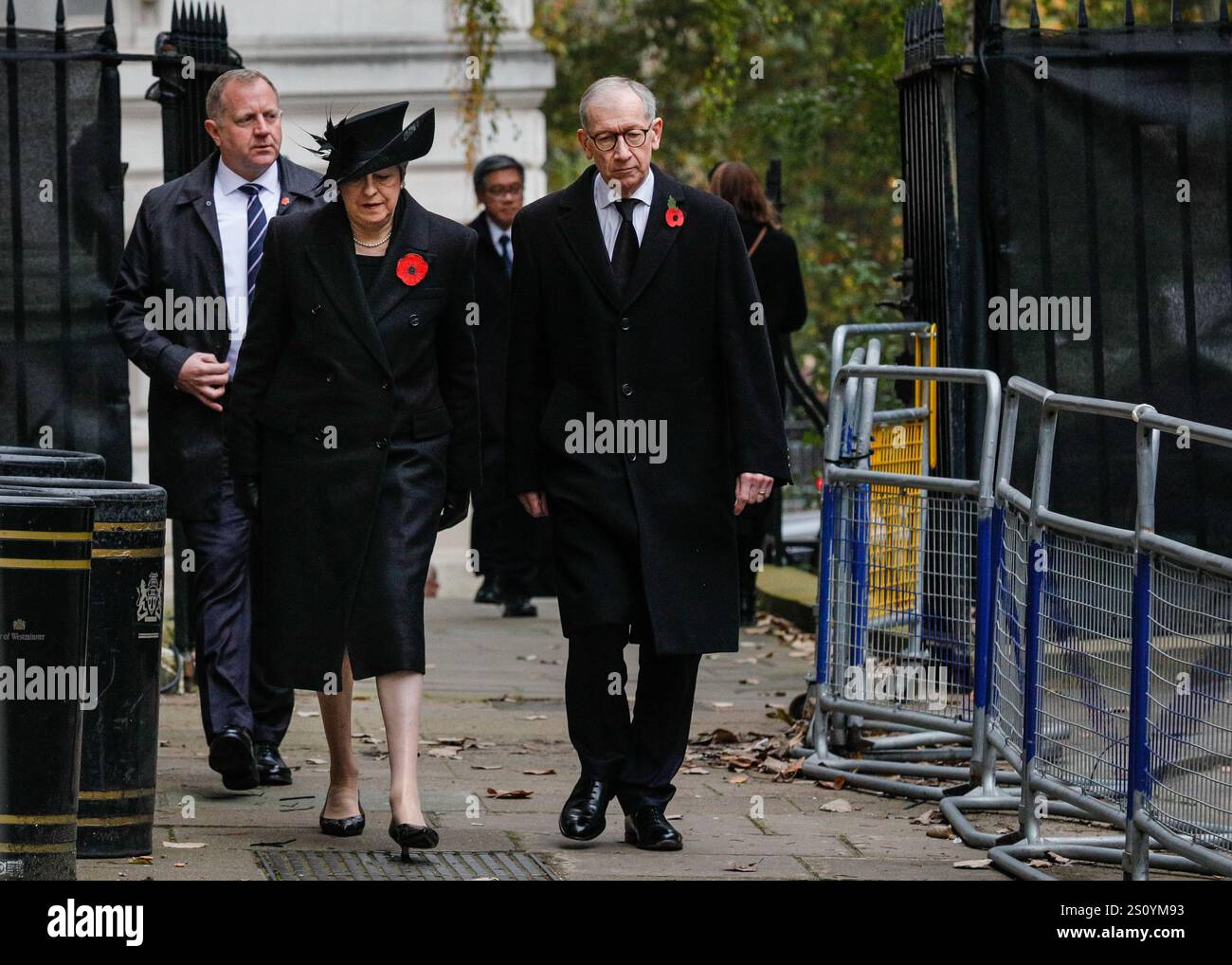 Theresa May, former Prime Minister of the United Kingdom walks with ...
