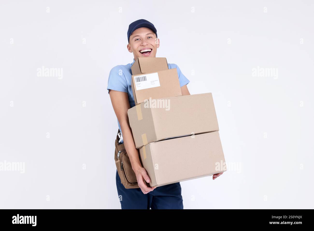 Happy postman with parcels on white background Stock Photo - Alamy
