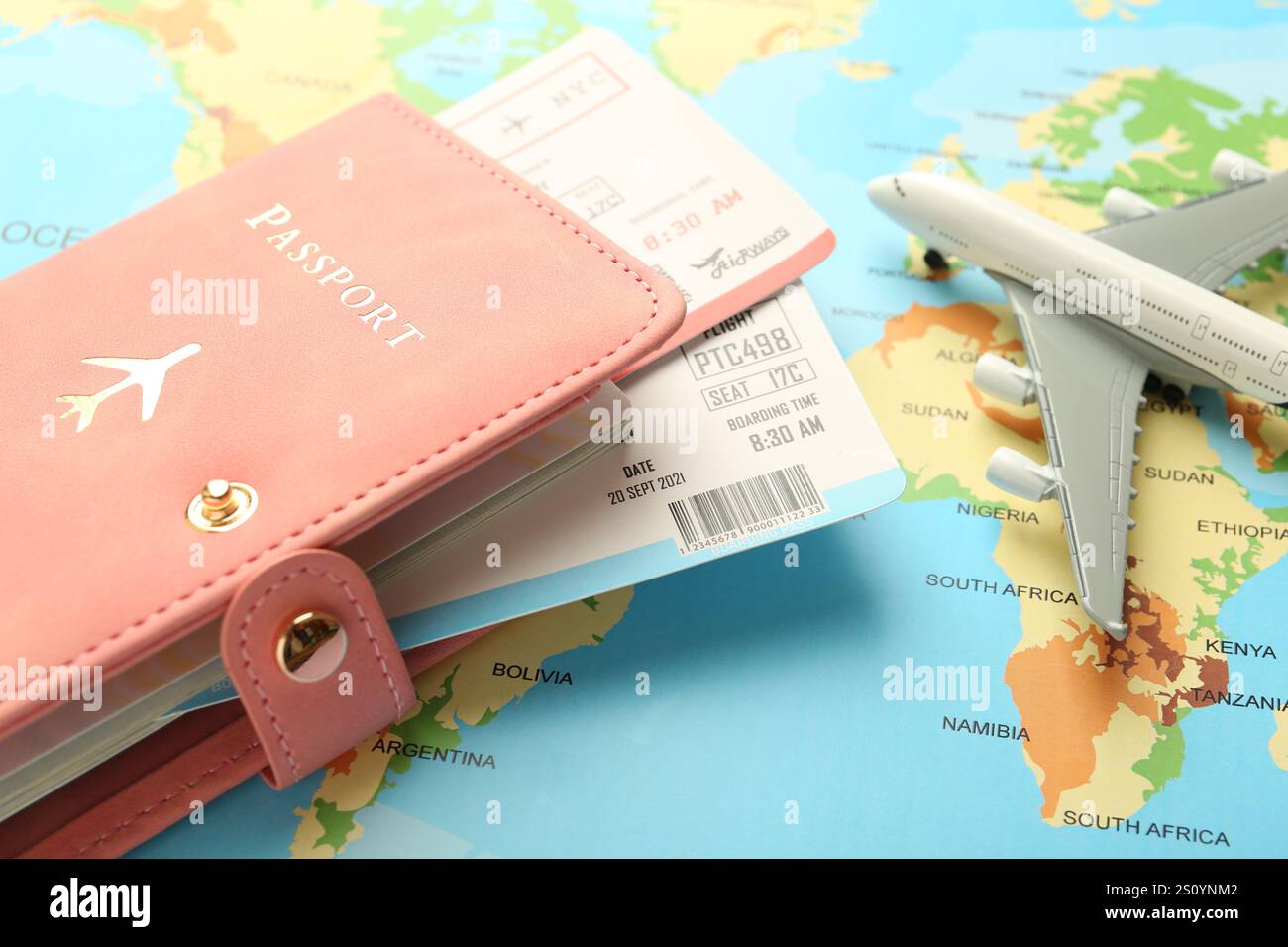 Passport with tickets and plane model on world map, closeup Stock Photo ...