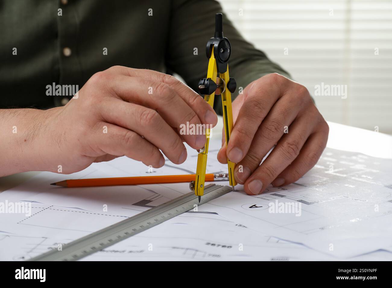 Architect working with project, closeup. Different technical drawings on table Stock Photo - Alamy
