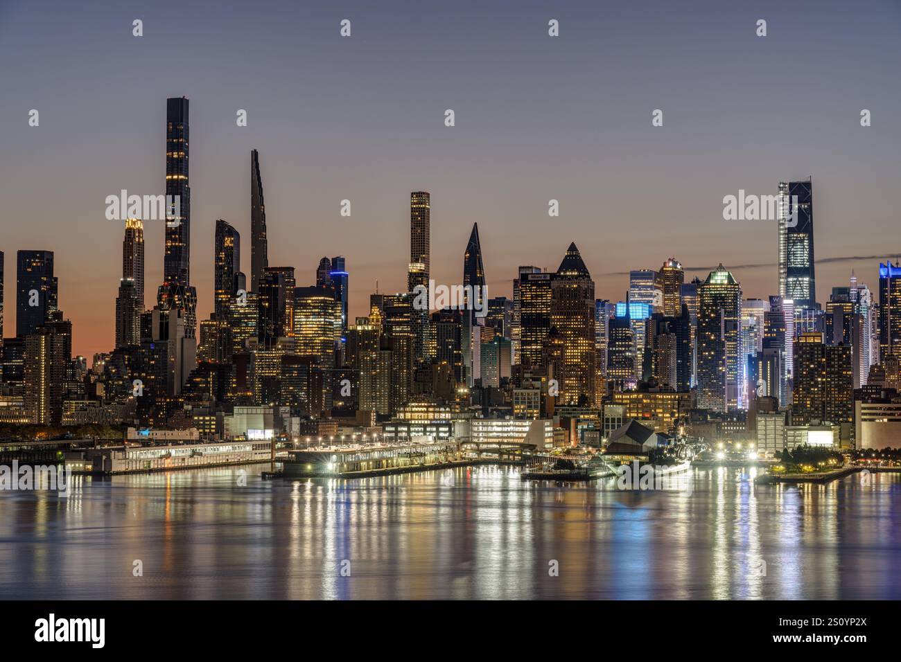 The skyline of Midtown Manhattan in New York at dawn with the pencil towers of Billionaires Row ...
