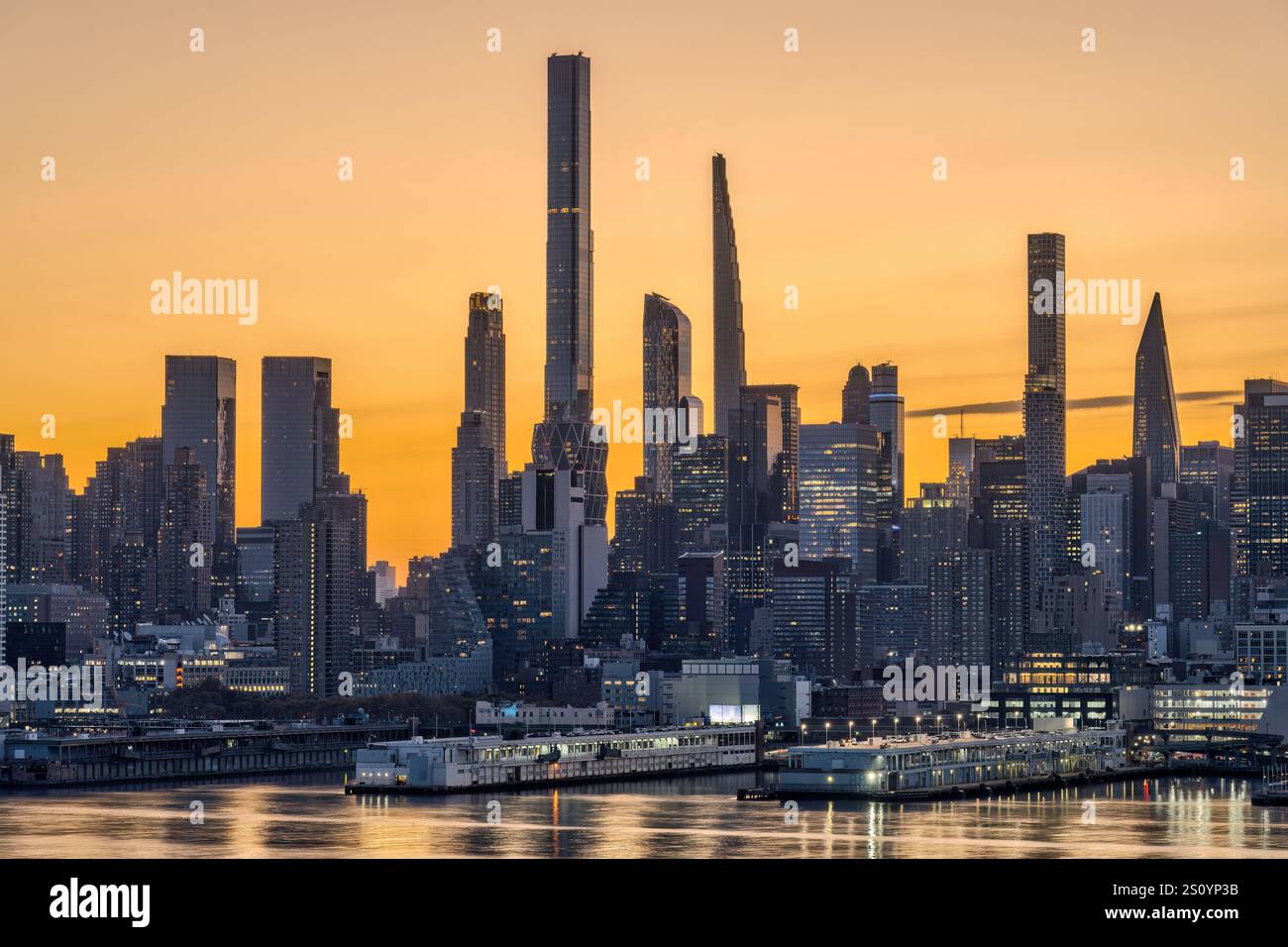 The skyline of Midtown Manhattan in New York before sunrise with the pencil towers of ...
