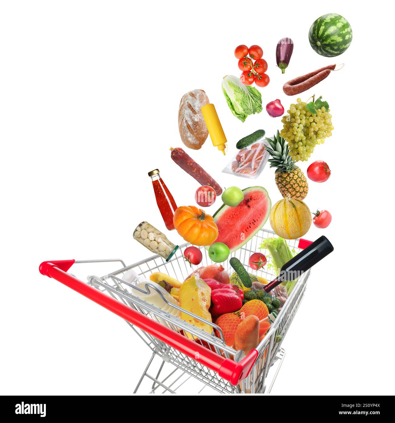 Many different products falling into shopping cart on white background ...