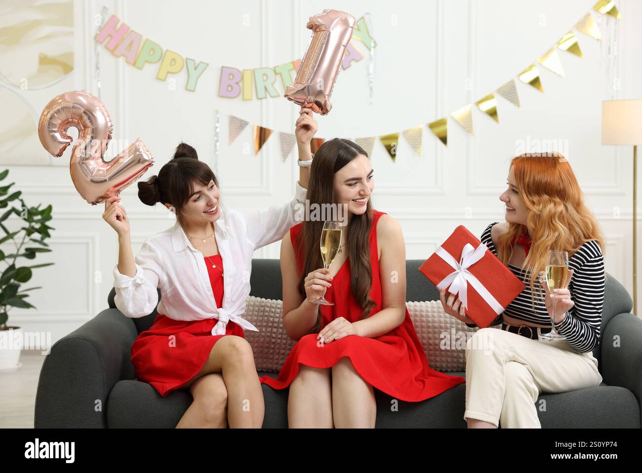 Coming of age party - 21st birthday. Group of young women celebrating ...