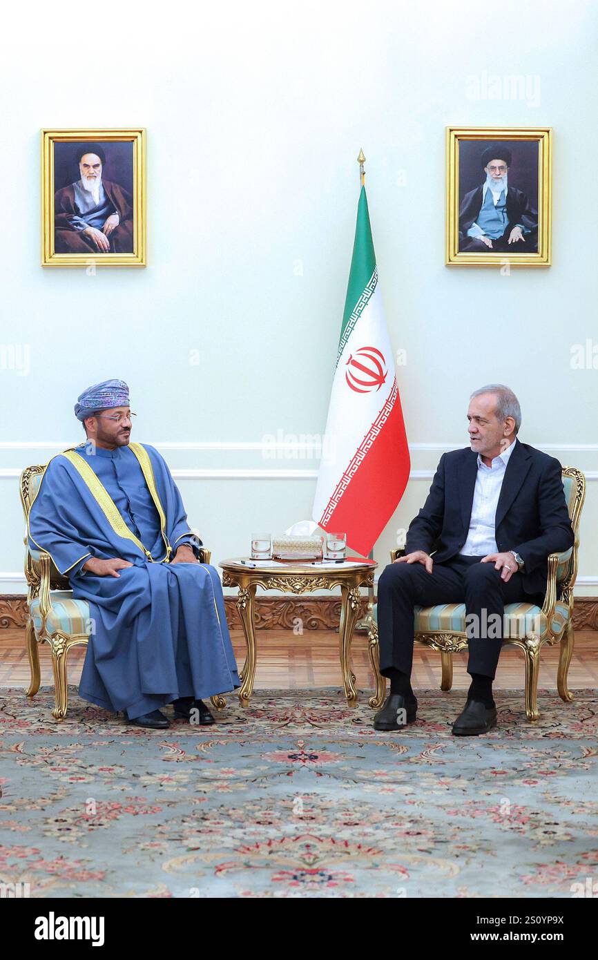In this photo released by the Iranian Presidency Office, President ...