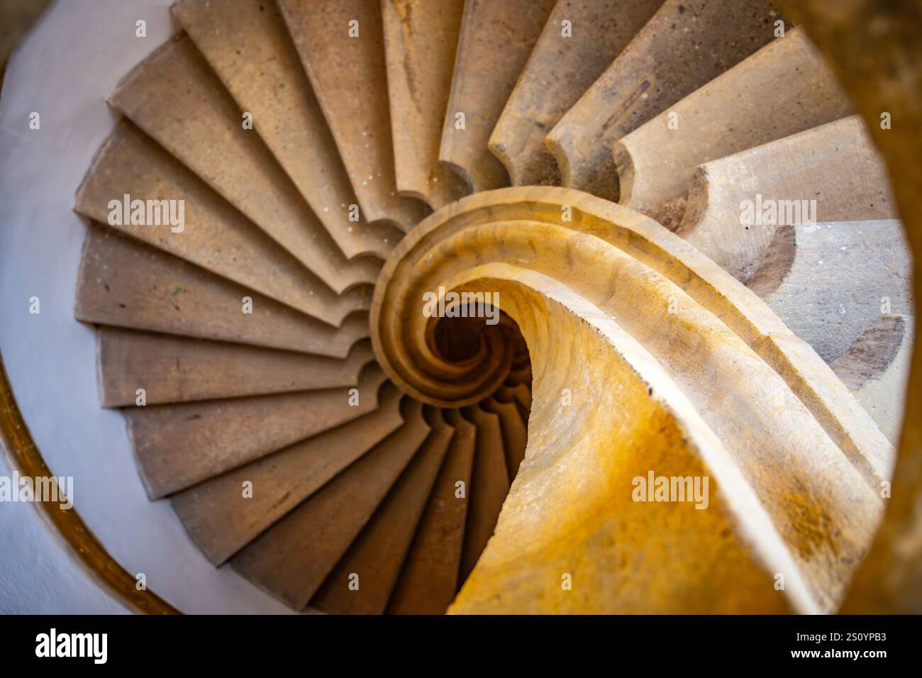 A stunning helical staircase spirals downwards, showcasing intricate ...