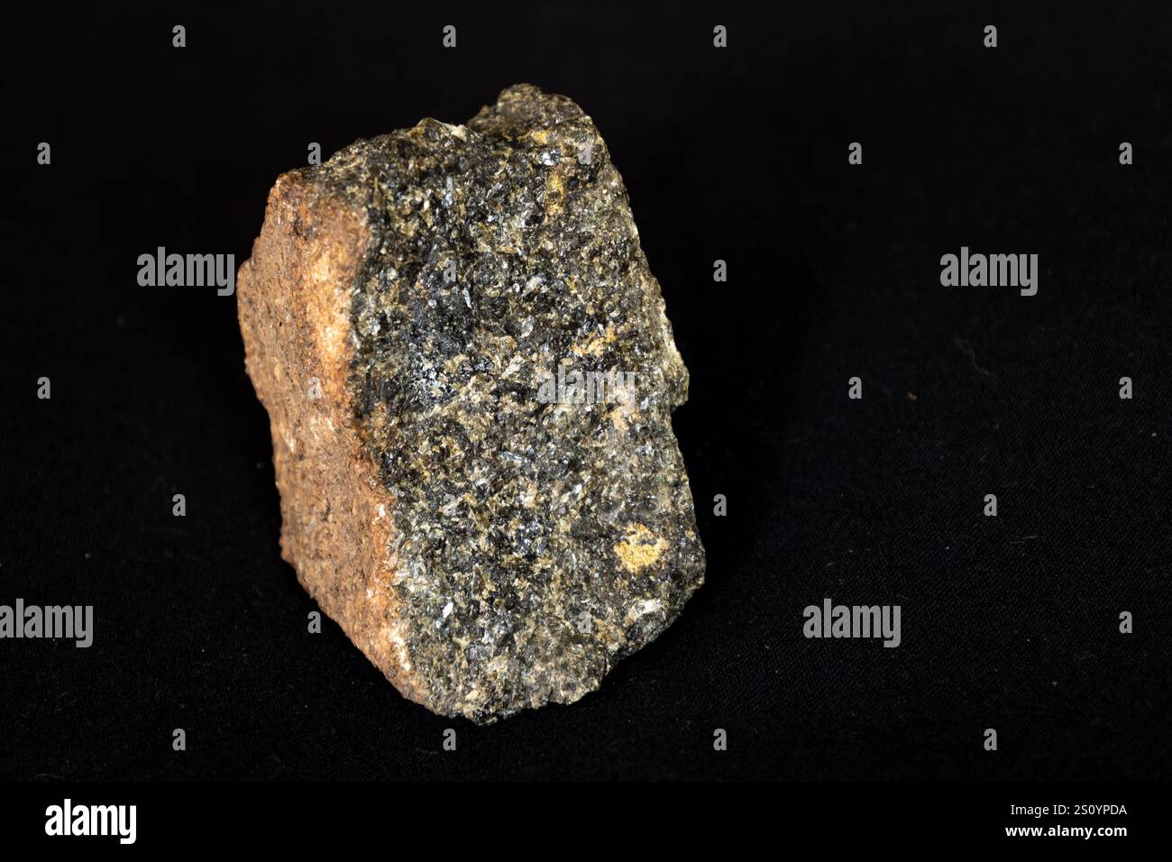 A sample of a type of peridotite called harzburgite, composed of ...