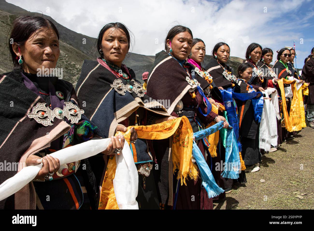 67th Shelri Dugdra Festival attendants line up with khata scarf to ...