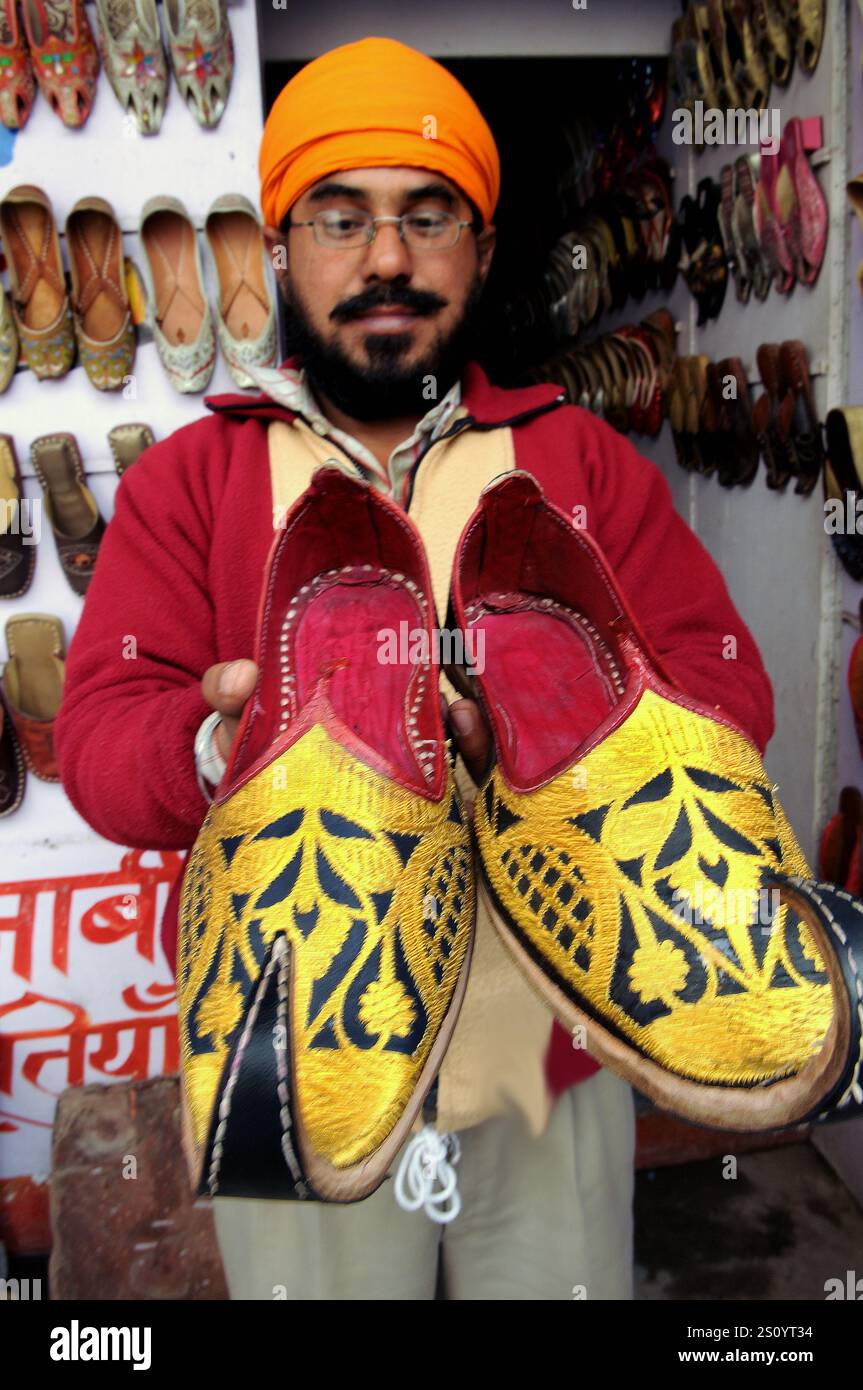 Traditional Punjabi shoes are being sold in one of the colorful shoe ...