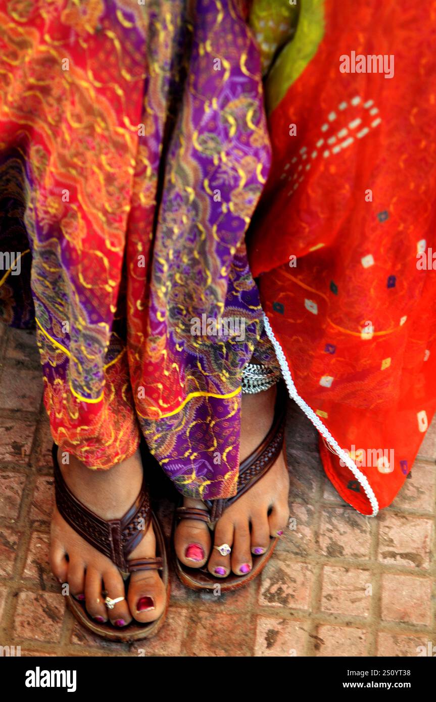 A Rajasthani woman with colorful toenails decoration. Photo taken in ...