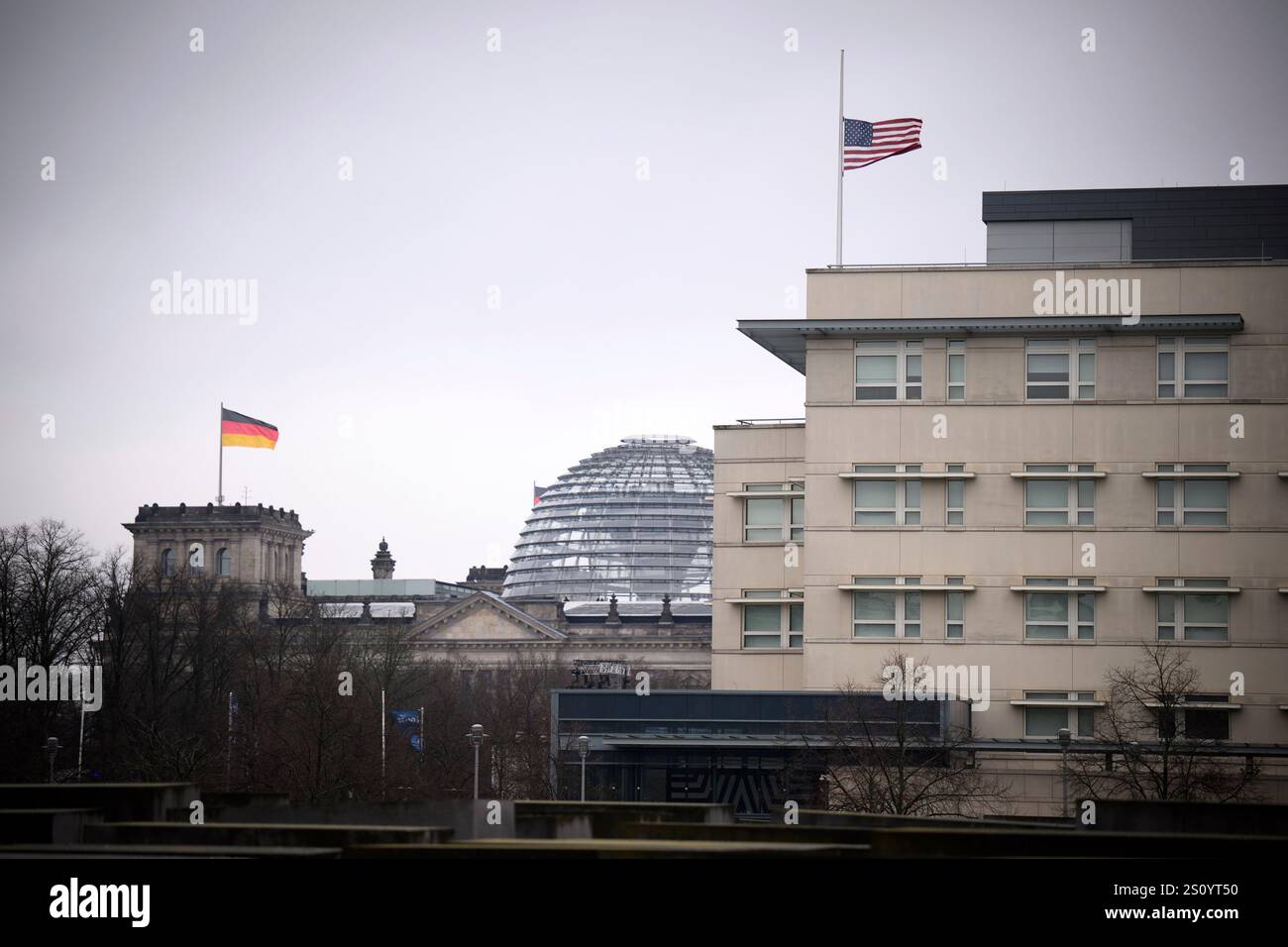 The U.S. flag at the Embassy of the United States, right, is seen flown ...