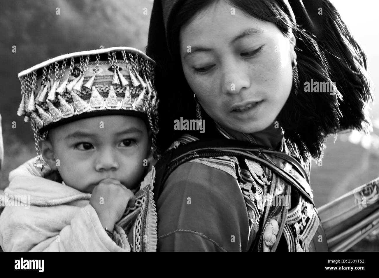 A Hani woman with her baby in South Yunnan province, China Stock Photo ...