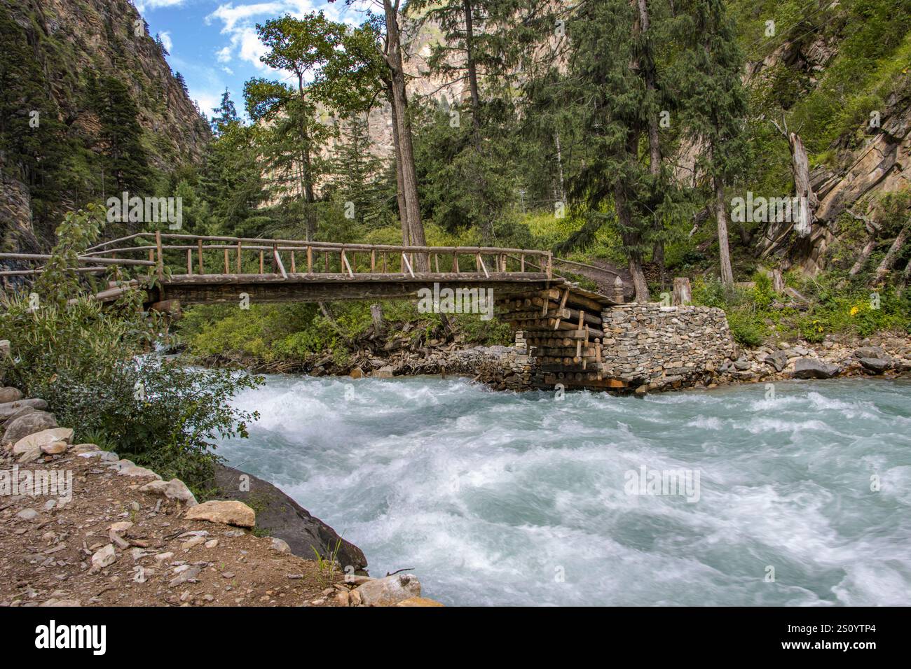 A traditional wooden bridge over the Bheri River in Dolpa, Nepal Stock ...