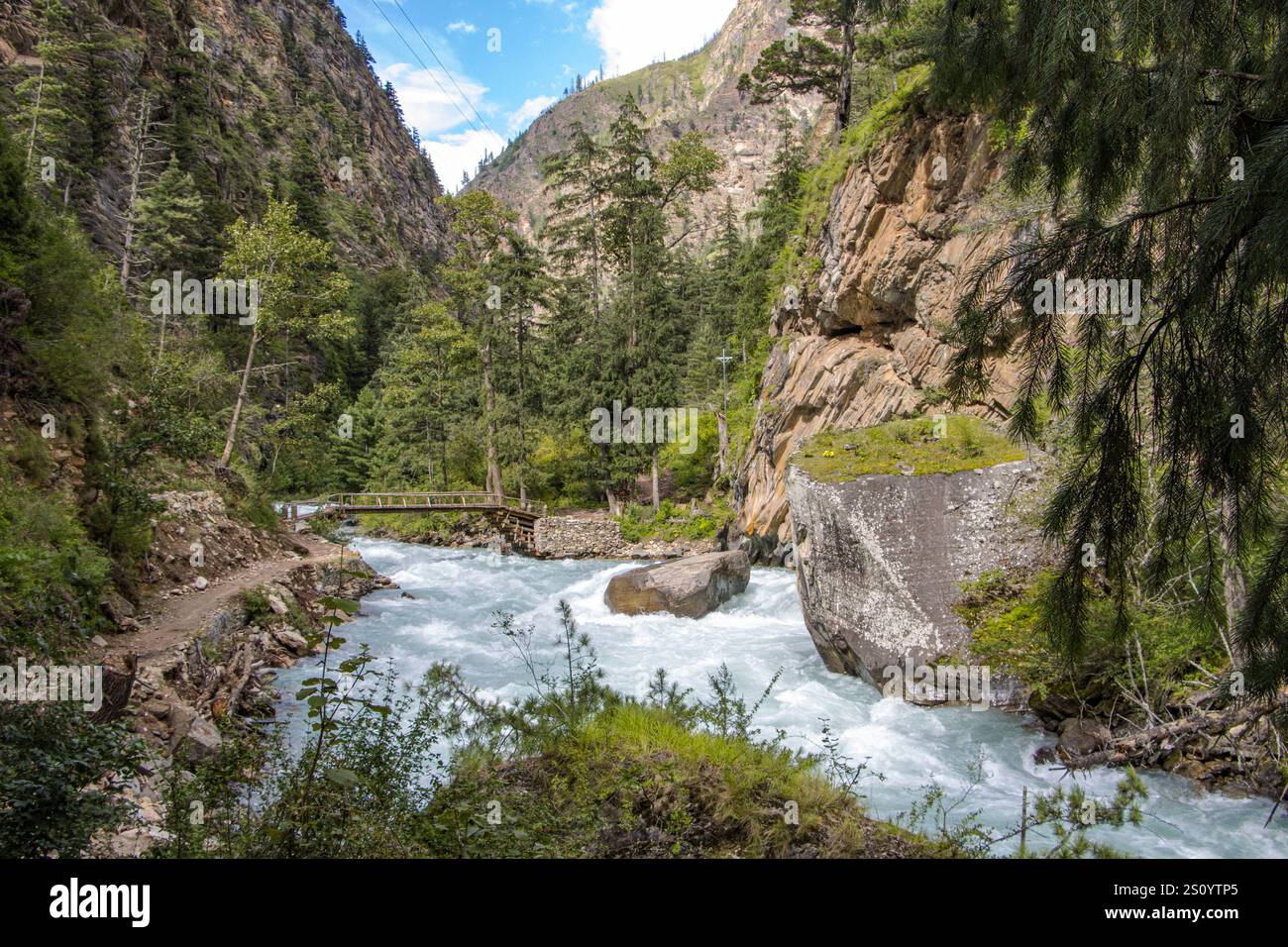 A traditional wooden bridge over the Bheri River in Dolpa, Nepal Stock ...