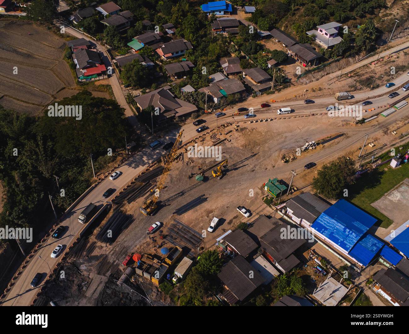 Aerial view of new road. Freeway under construction in mountainous area ...