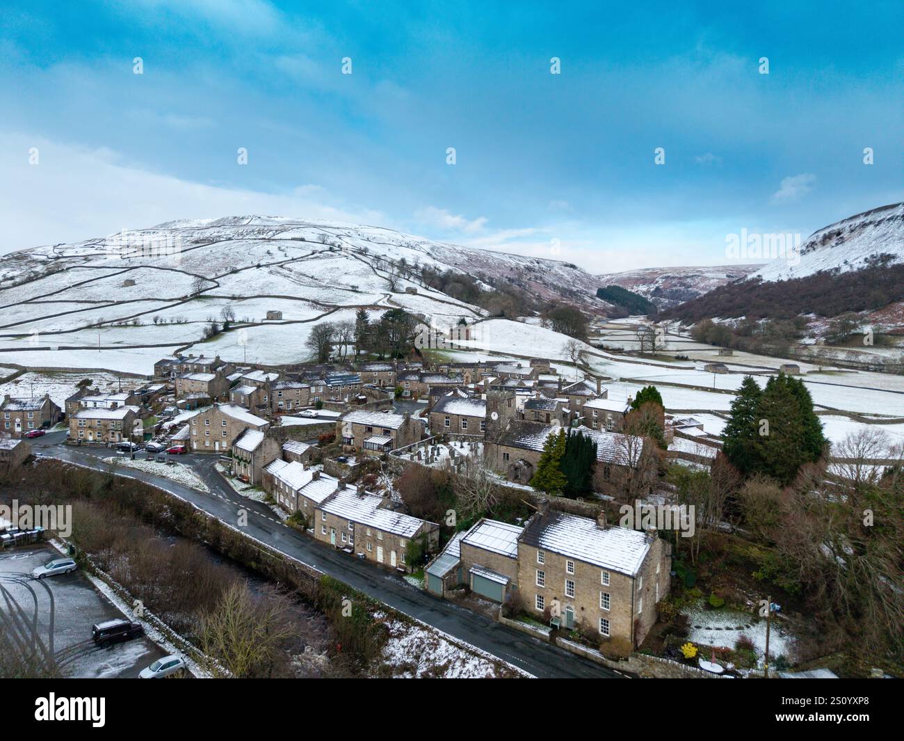 The village of Muker in Swaledale with a covering of snow on an early ...