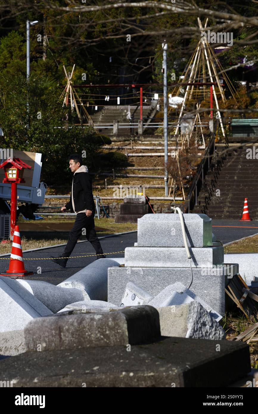 A lantern remains collapsed at a shrine in Suzu, Ishikawa Prefecture ...