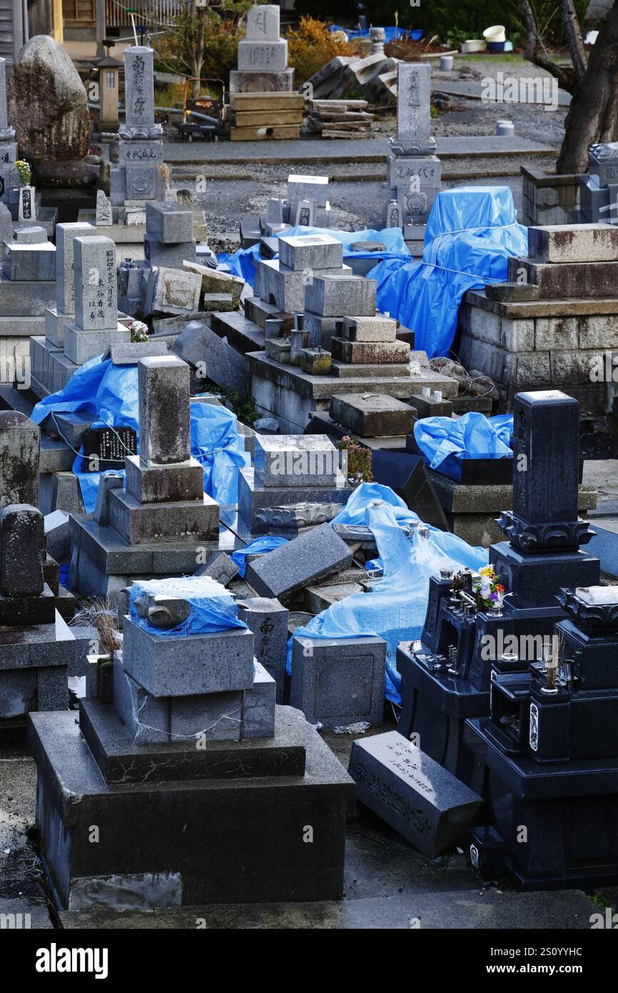 Gravestones remain collapsed in Wajima, Ishikawa Prefecture, on Dec. 24 ...
