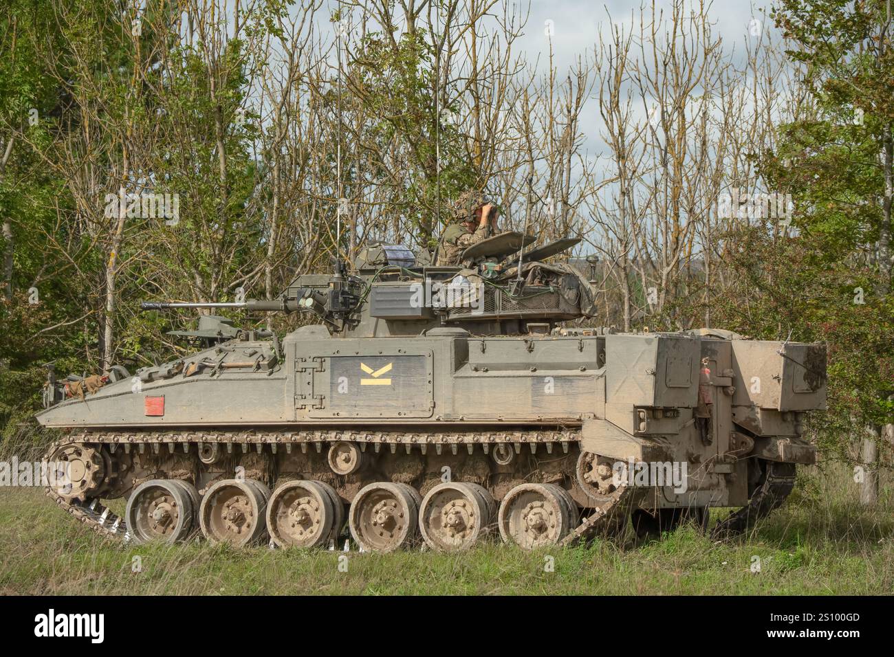 close-up of a commander and gunner directing a British army Warrior ...