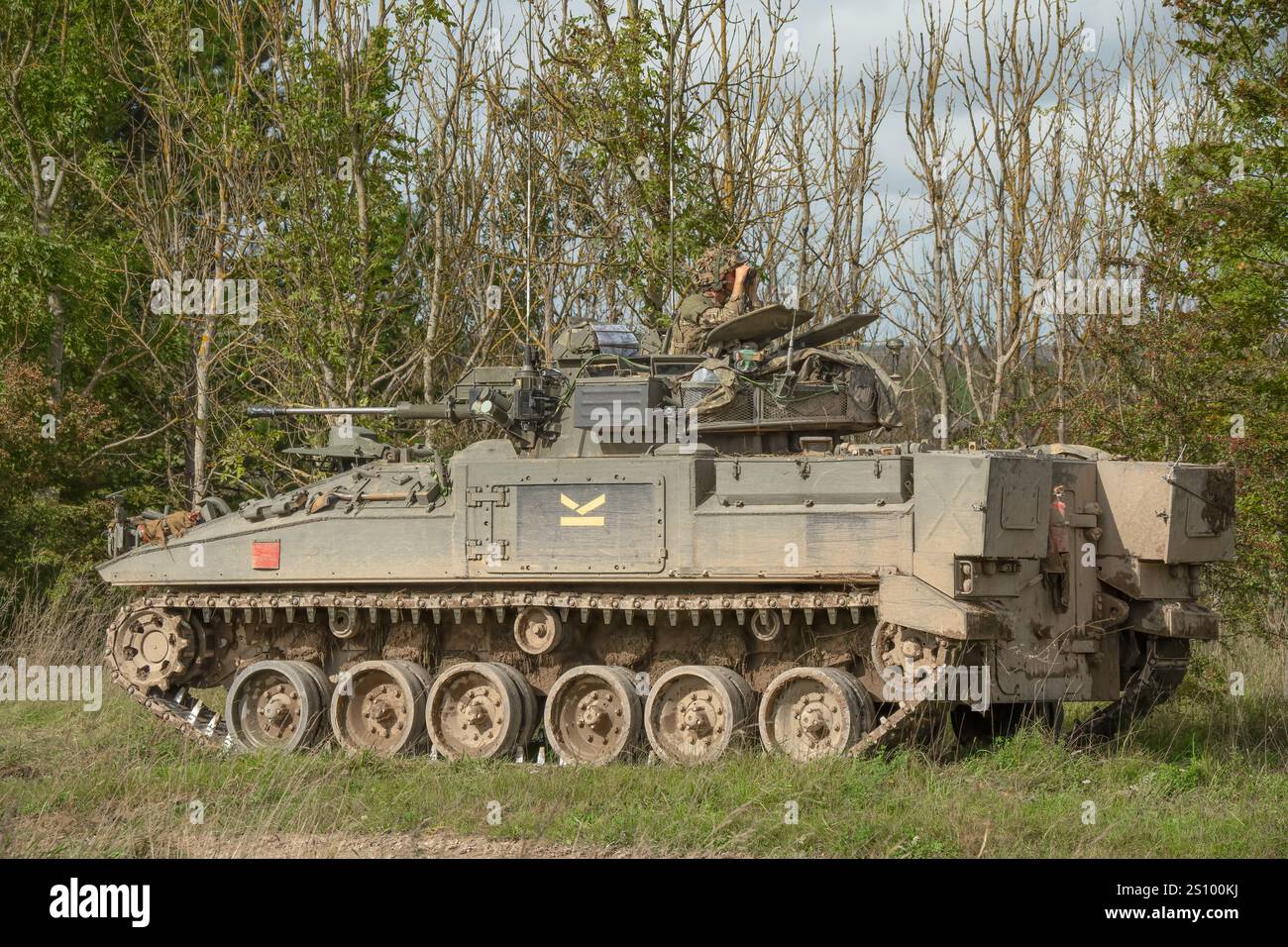 close-up of a commander and gunner directing a British army Warrior ...