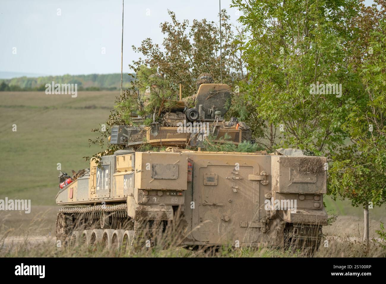 close-up of a commander and gunner directing a British army Warrior ...