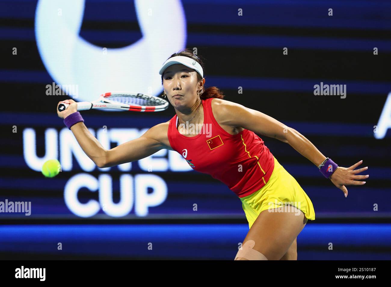 Xinyu Gao of China plays a return shot to Laura Siegemund of Germany ...