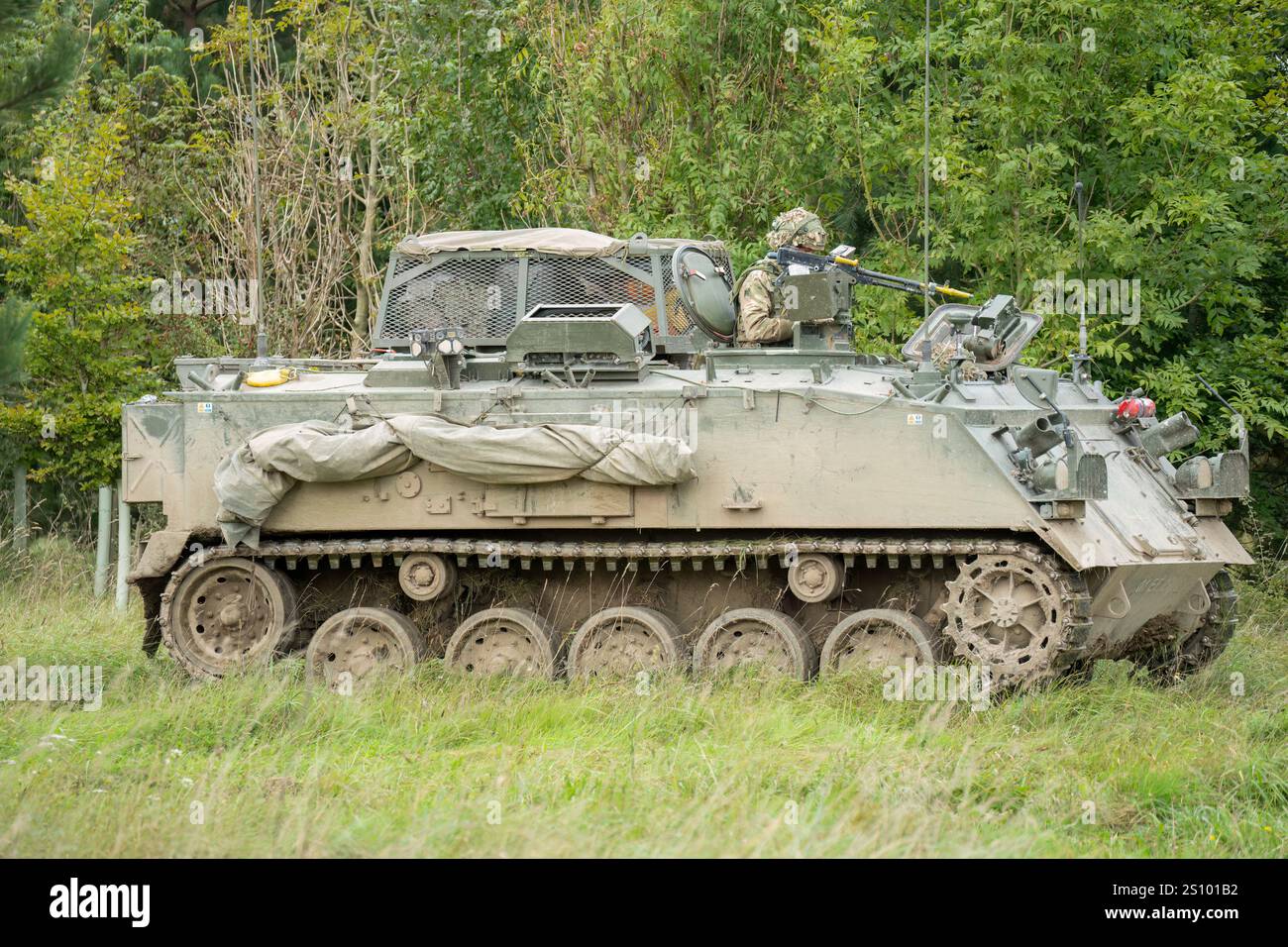 soldier commanding a british army Bulldog FV432 tank in action on a ...