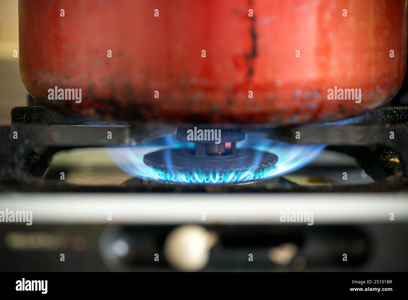 Gas stove burner blue flame cooking Stock Photo - Alamy