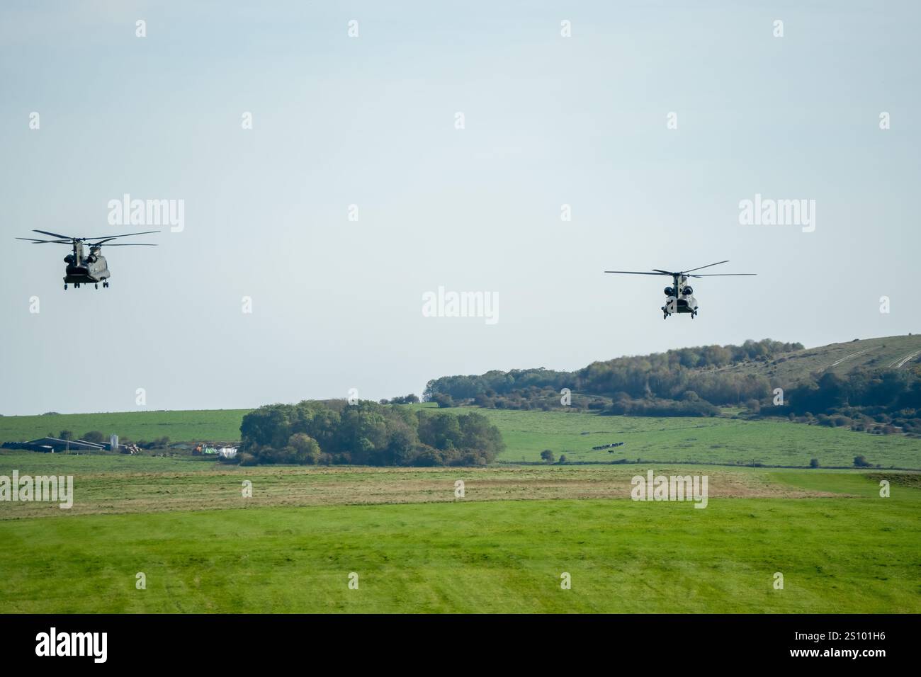 a pair of British army Boeing Chinook CH-47 helicopters hovering over ...
