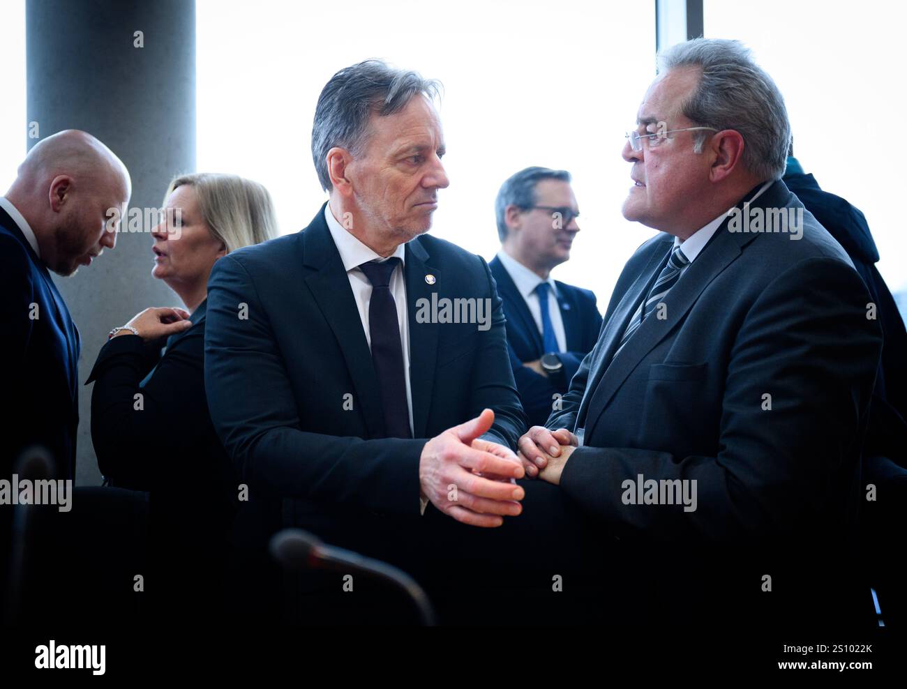 30 December 2024, Berlin: Holger Münch (center), President of the ...