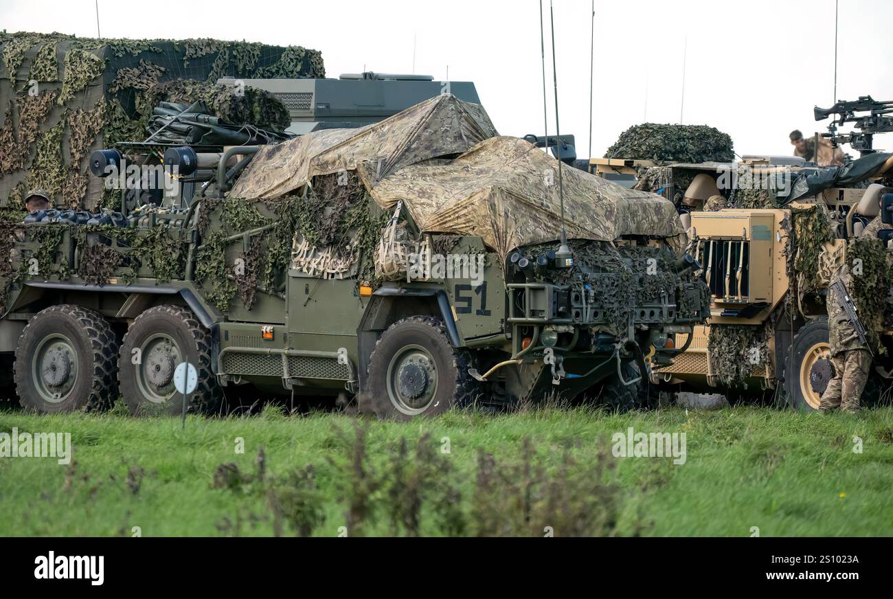 a division of British army cavalry and armoured brigades assembled in a ...