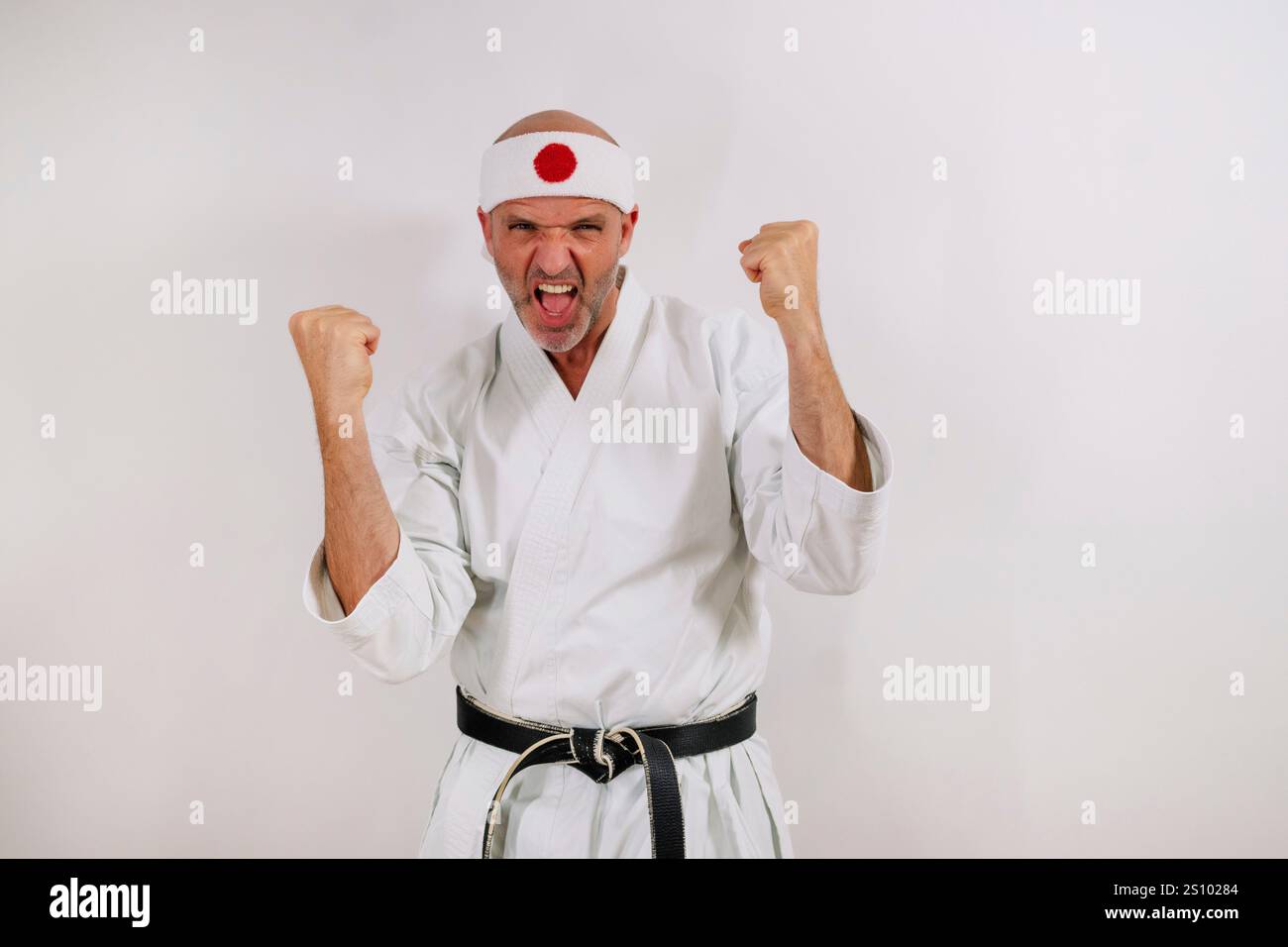 Black belt karate master euphoric Stock Photo - Alamy