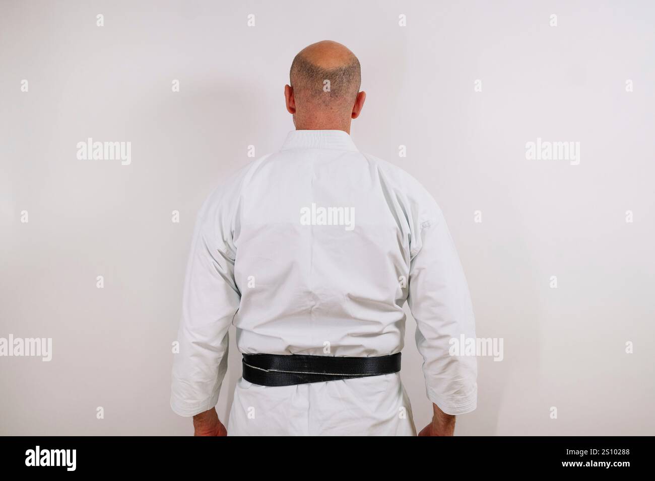 Black belt karate master showing his back Stock Photo - Alamy