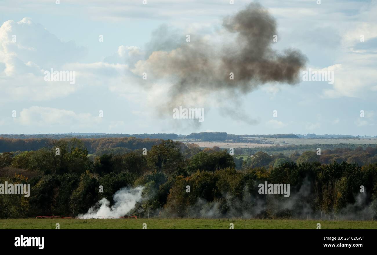 white smoke rising after an artillery shell impact explosion Stock ...