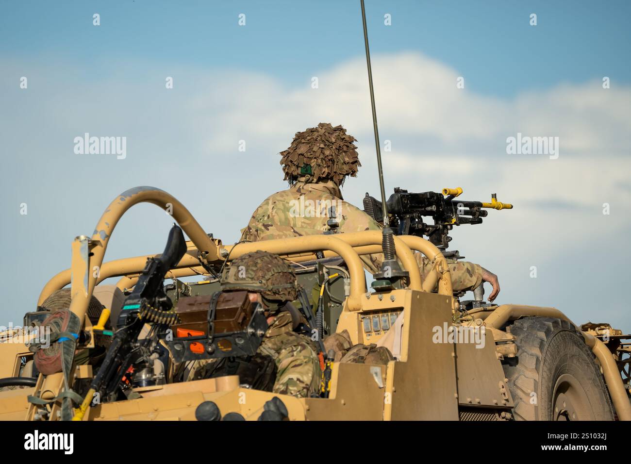 soldier mans a machine gun atop a British army Supacat Jackal 4x4 ...