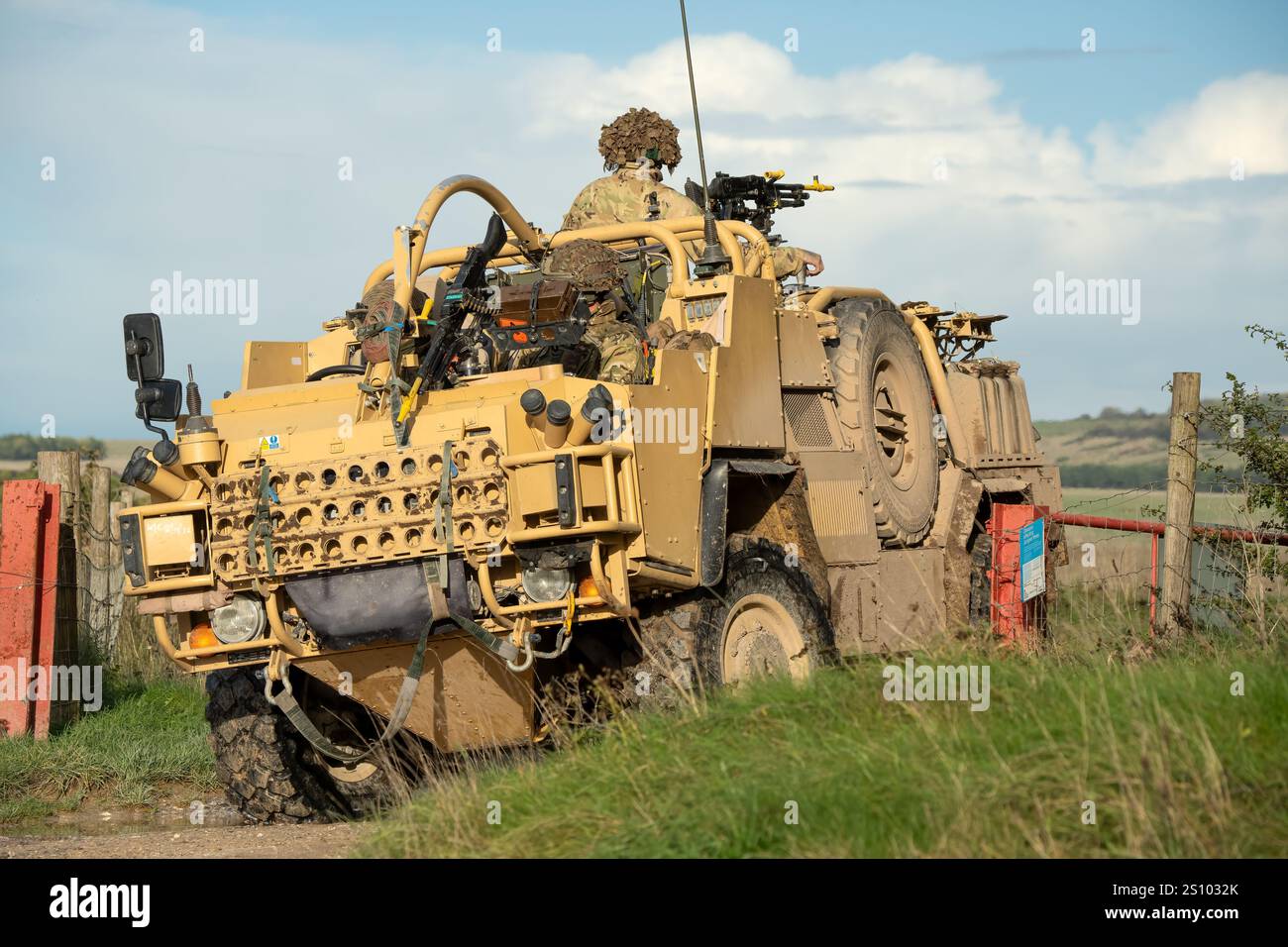 soldier mans a machine gun atop a British army Supacat Jackal 4x4 ...