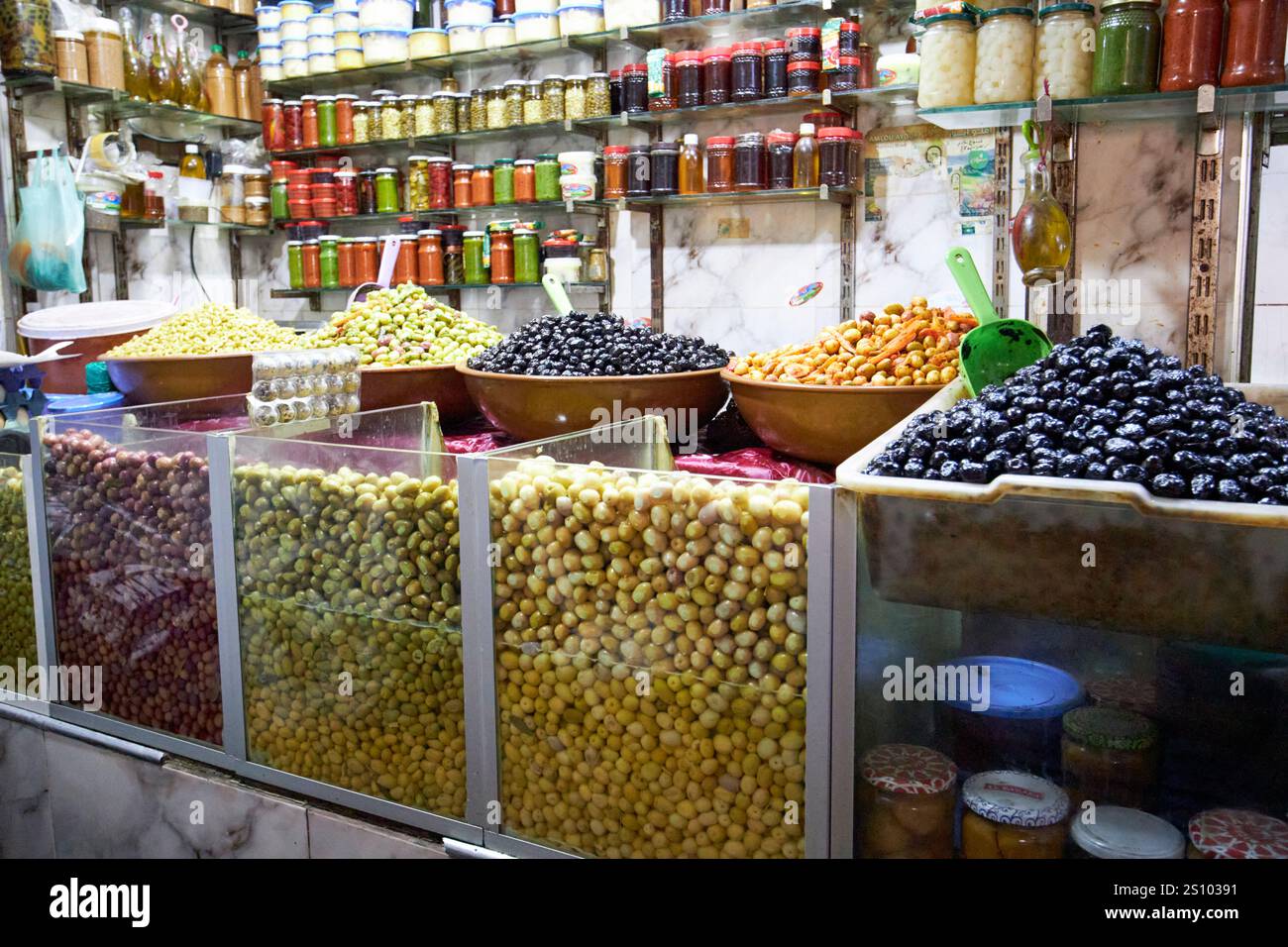 fresh olives on display at a stall in the jewish food market of ...