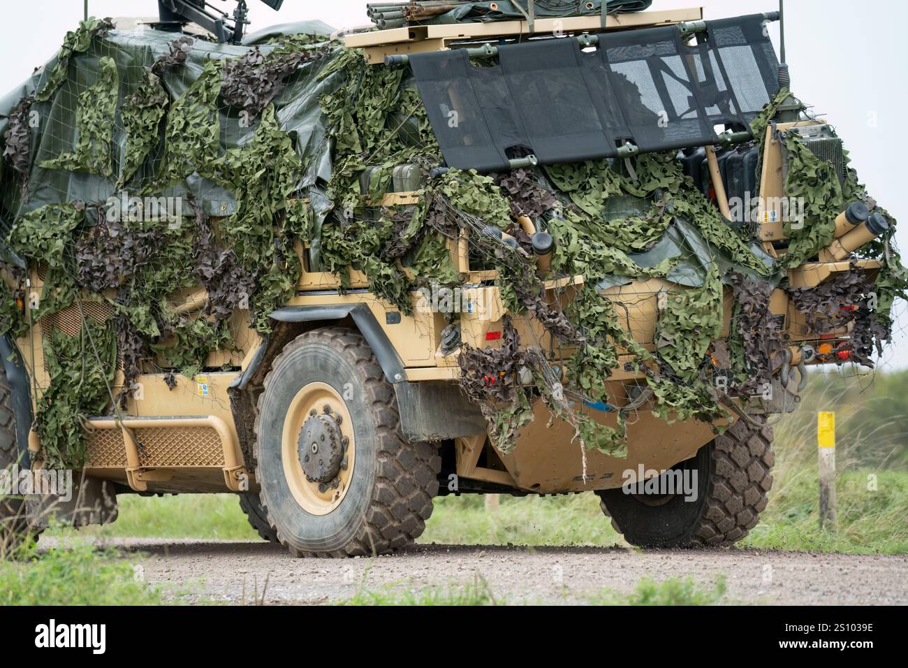 close-up of a British army Supacat Jackal 4x4 vehicle in action on a ...