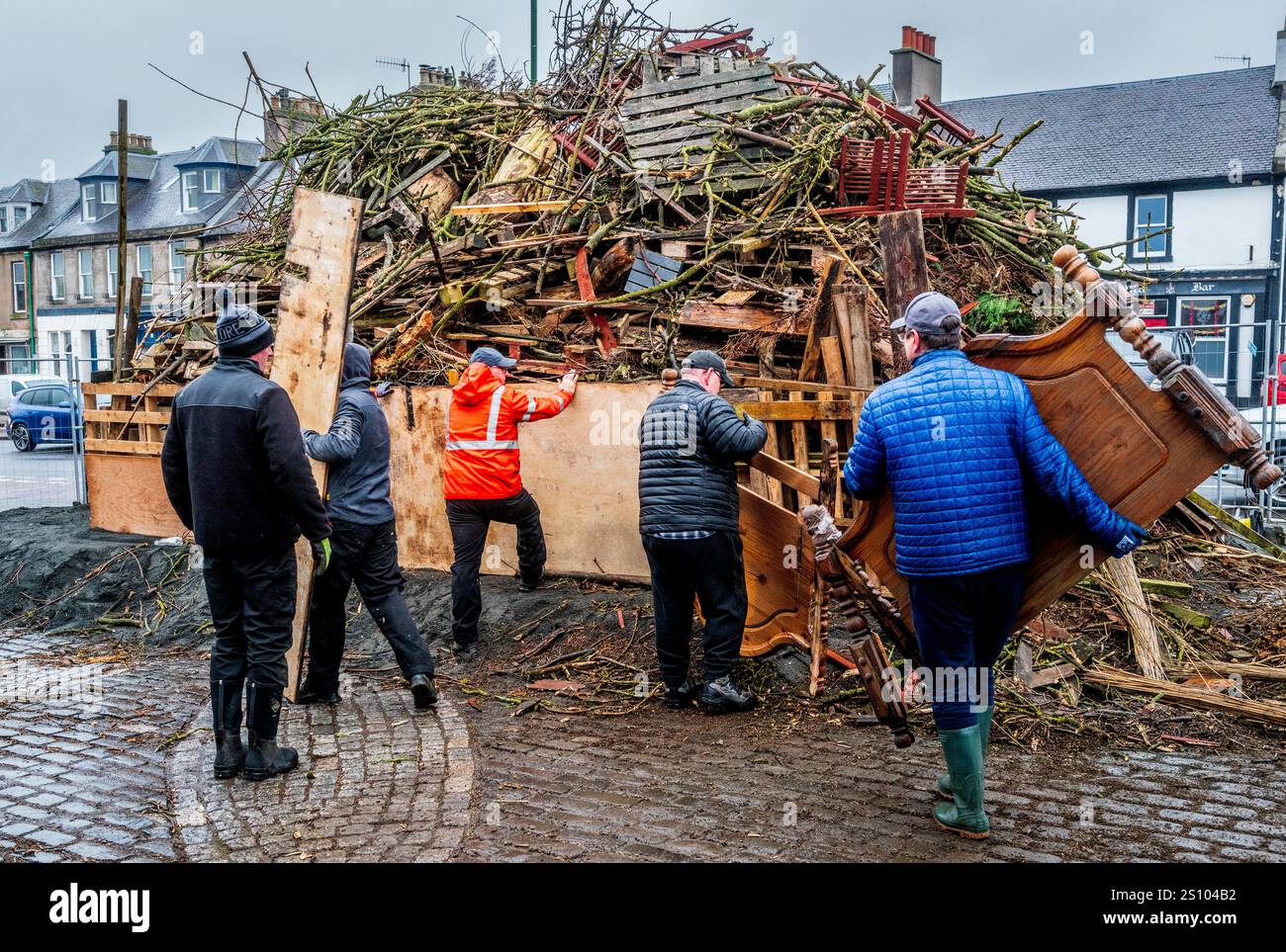 Building the traditional hogmanay bonfire in Biggar, South Lanarkshire ...