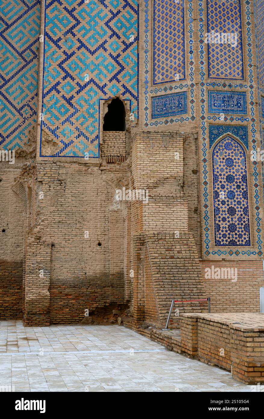 A fragment of ancient brickwork, mosaics and traditional blue-turquoise ...