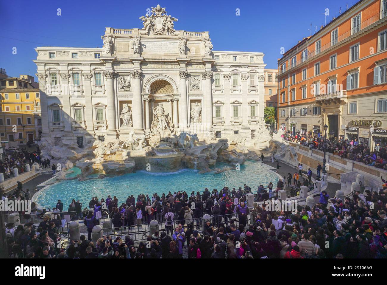 Rome, Italy. 30 December 2024 Large crowds gather at the Trevi fountain ...