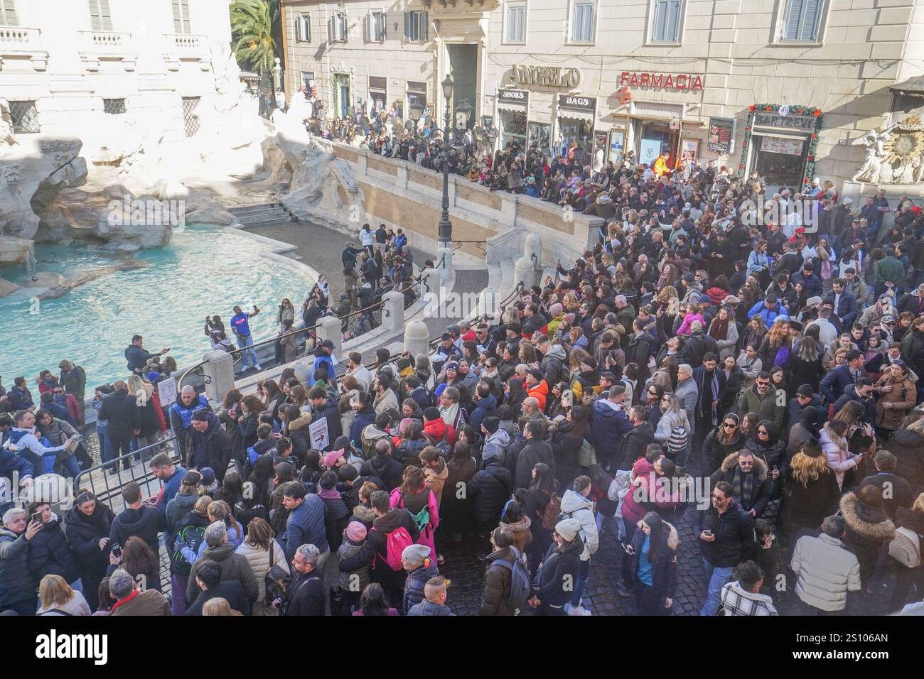 Rome, Italy. 30 December 2024 Large crowds gather at the Trevi fountain ...