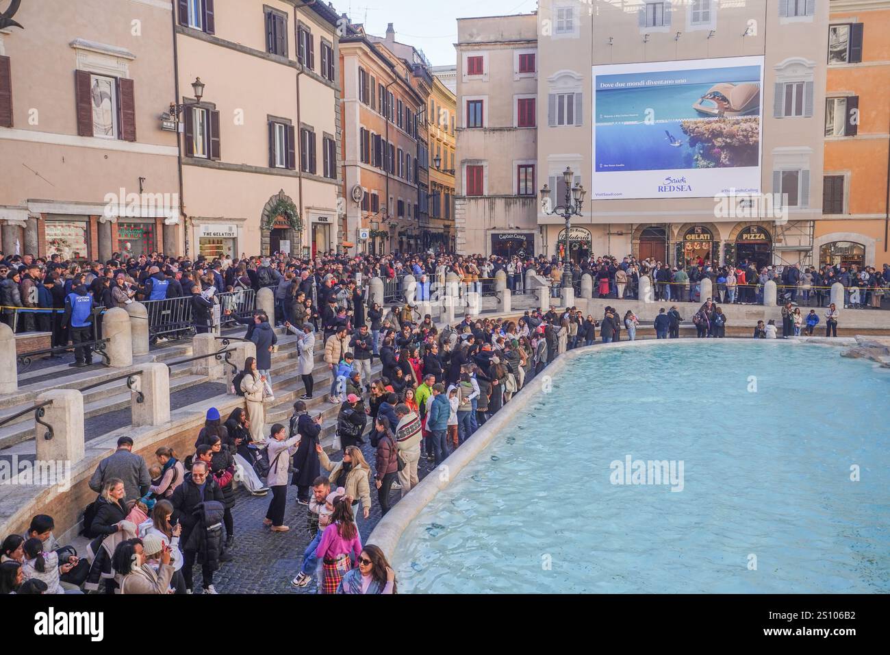 Rome, Italy. 30 December 2024 Large crowds gather at the Trevi fountain ...