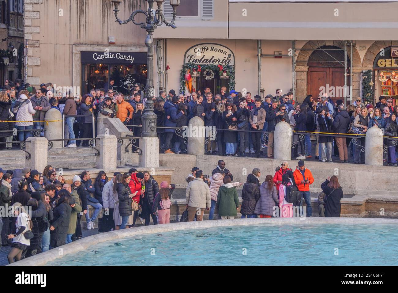 Rome, Italy. 30 December 2024 Large crowds gather at the Trevi fountain ...