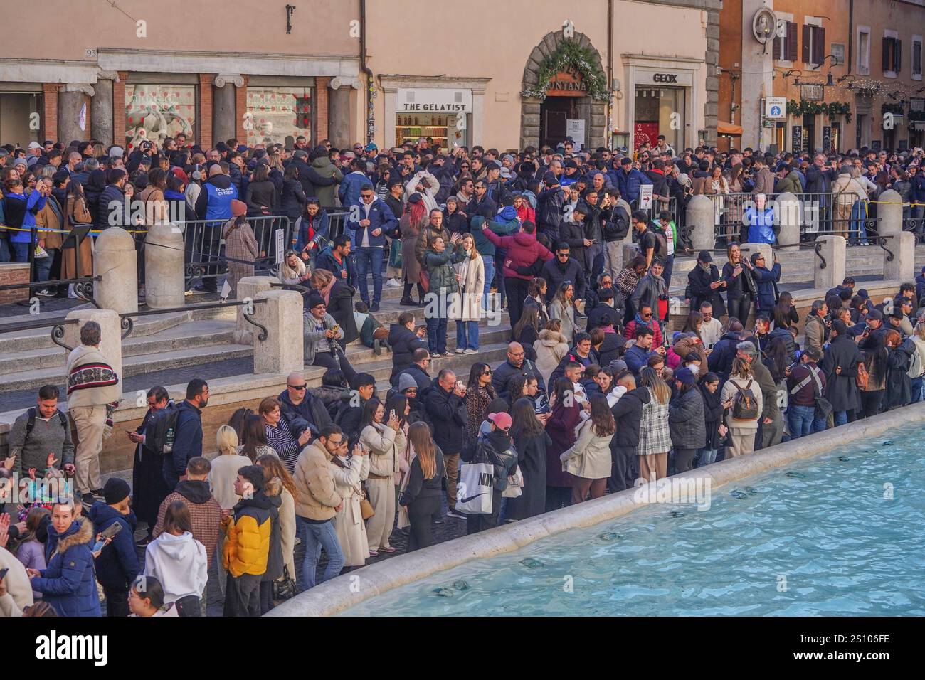 Rome, Italy. 30 December 2024 Large crowds gather at the Trevi fountain ...