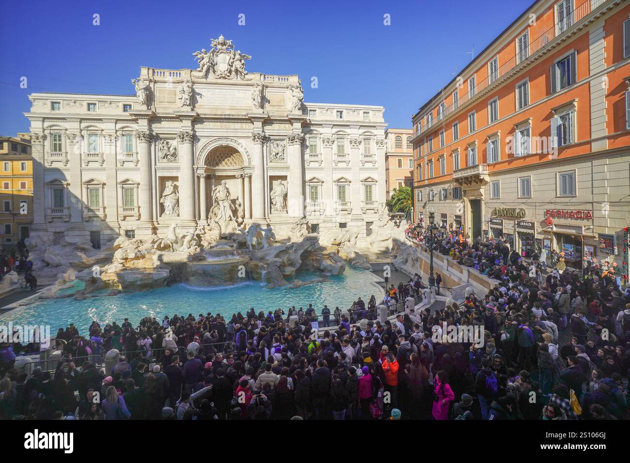 Rome, Italy. 30 December 2024 Large crowds gather at the Trevi fountain ...