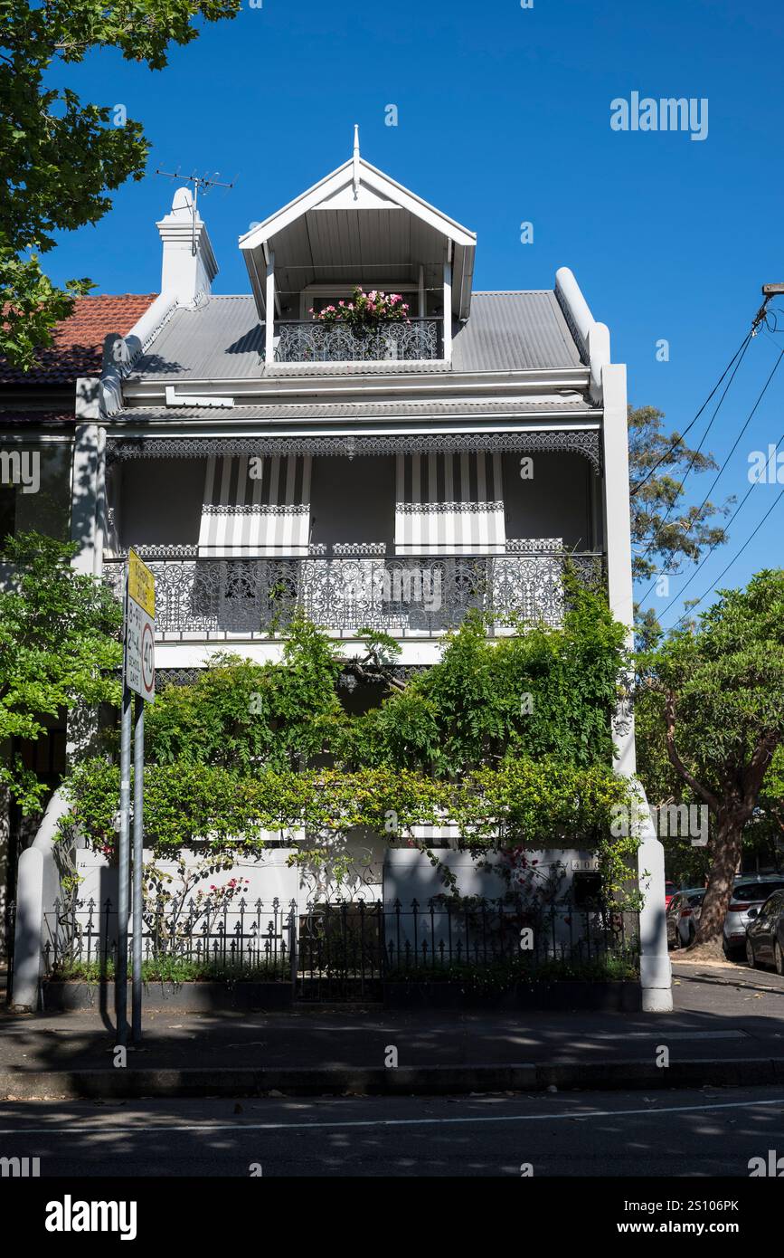 Residential Victorian-era house adorned with ornamental iron lacework ...