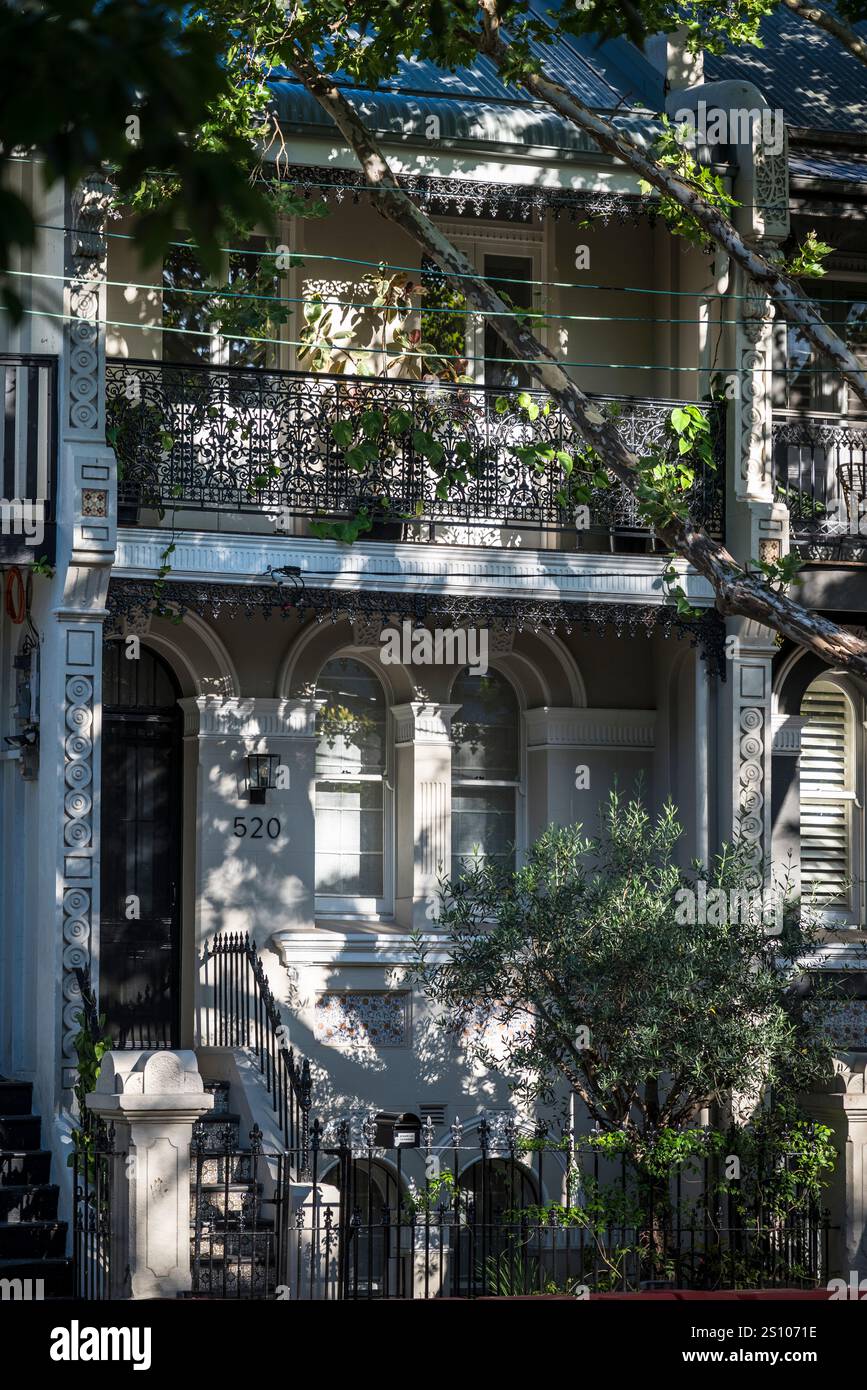 Residential Victorian-era house adorned with ornamental iron lacework ...
