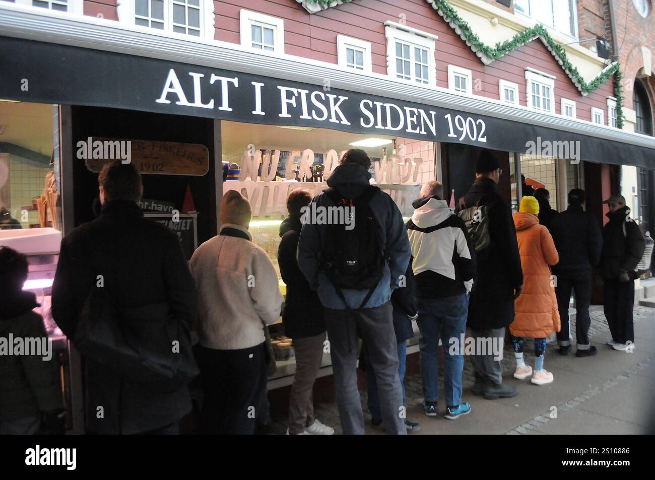 Copenhagen/ DenmarK/30 DECEMBER 2024/Danes waiting at fish shop in ...