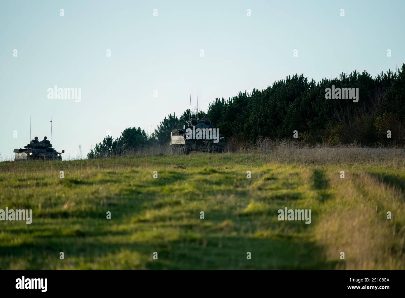 commander and gunner directing a British army Warrior FV510 IFV in ...
